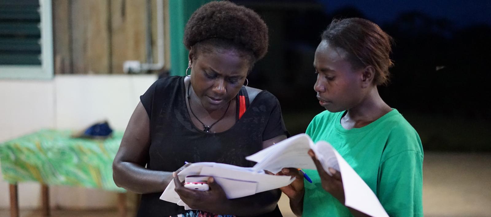 Two women take part in a mock polling observer training in the ...